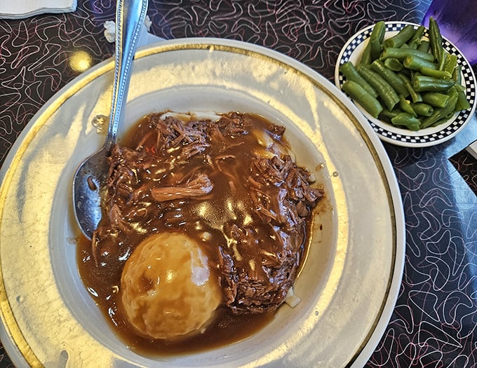Pot roast that looks like it's been simmering since the Eisenhower administration, served with green beans that actually taste like vegetables.