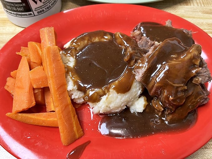Pot roast that falls apart at the mere suggestion of a fork, swimming in gravy rich enough to make your cardiologist nervously update your chart.