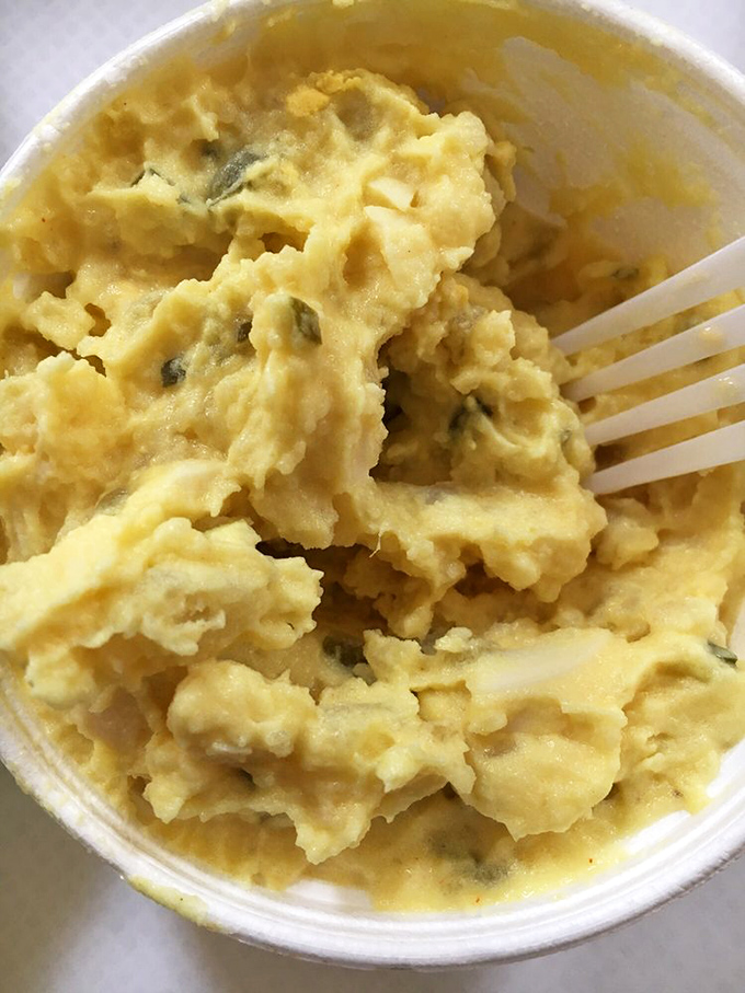 Potato salad with visible chunks of pickle&mdash;the kind of side dish that could easily steal the spotlight from lesser meats.