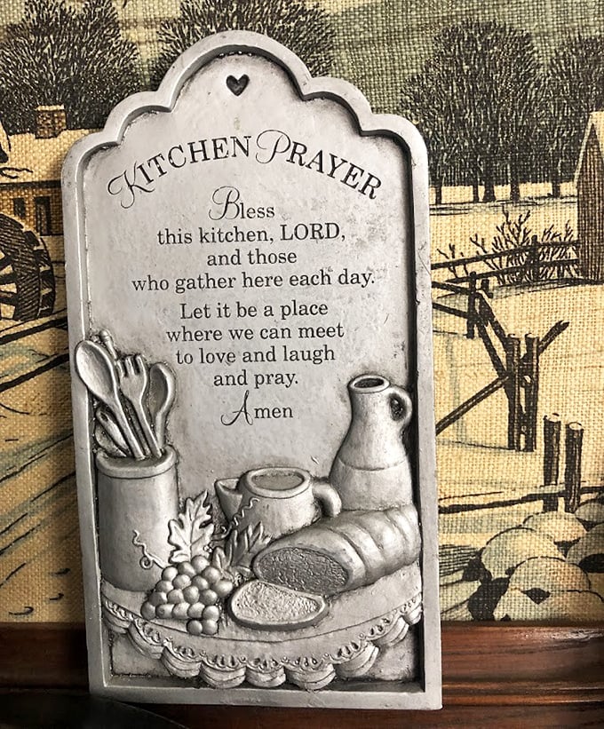 This "Kitchen Prayer" plaque might have graced grandma's wall for decades before landing here, ready for its next home.