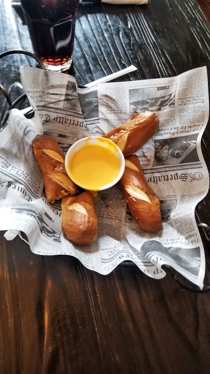 Pretzel perfection with cheese sauce that glows like liquid gold&mdash;carbs have never looked this good in newspaper.