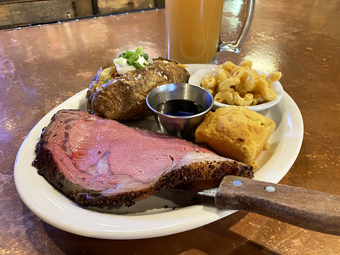 Prime rib that's blushing pink in all the right places, alongside a loaded baked potato that's practically begging to complete your perfect bite.