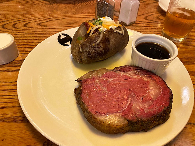 Prime rib so perfectly pink it should be on a Valentine's card, accompanied by a loaded baked potato that's practically a meal unto itself.