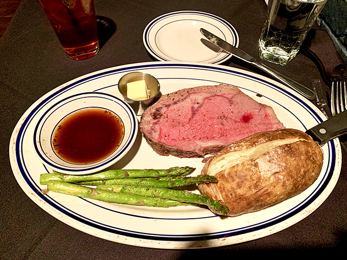 Prime rib so perfectly pink it could make a vegetarian question their life choices. The asparagus and baked potato are just along for the magnificent ride.
