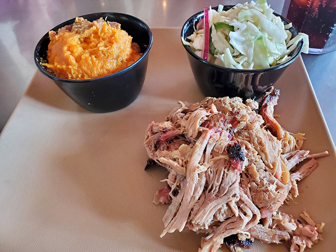 Pulled pork so tender it practically surrendered to the smoker, with sides that know their supporting role but still steal scenes.