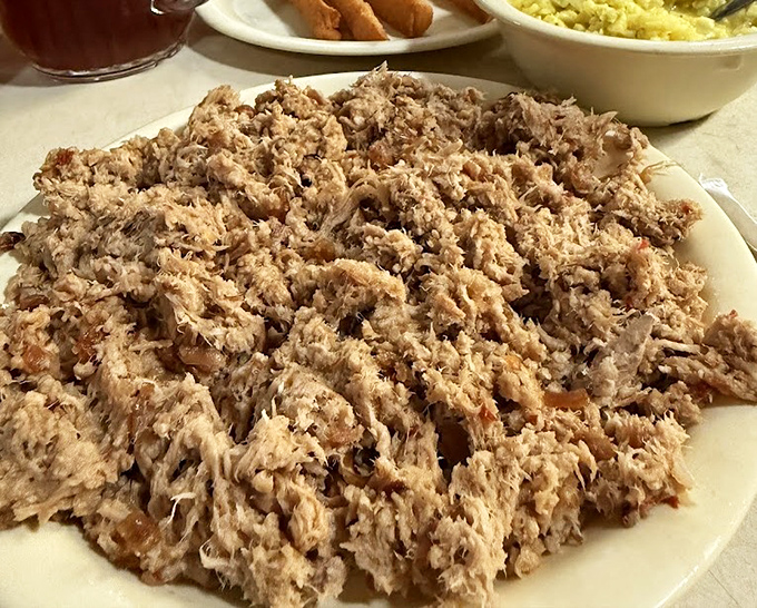 Eastern-style chopped pork in its natural habitat&mdash;piled high on a simple white plate. No fancy garnishes needed when the smoke has been doing all the talking.