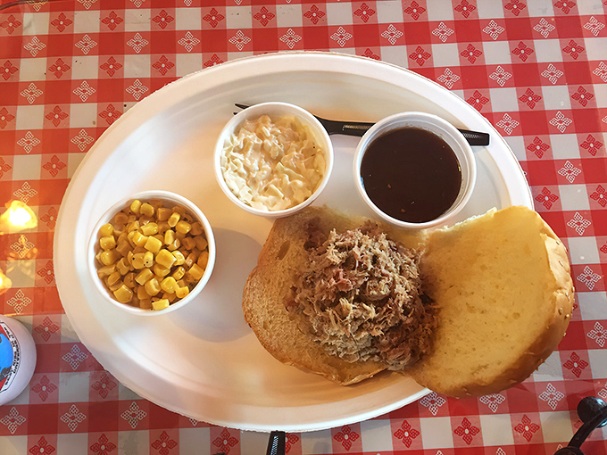 A pulled pork sandwich with all the fixings &ndash; because sometimes happiness comes between two pieces of bread.