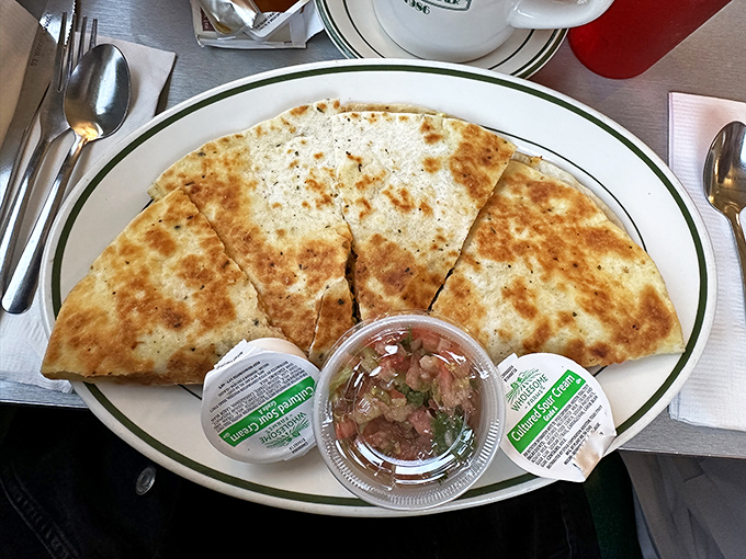 The quesadilla that launched a thousand return visits &ndash; crispy, cheesy, and served with a side of "why didn't I order two?"