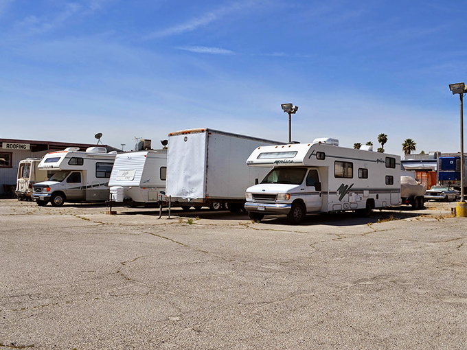 The parking lot doubles as an RV showcase, proving that even nomadic homes sometimes need new owners to continue their adventures.