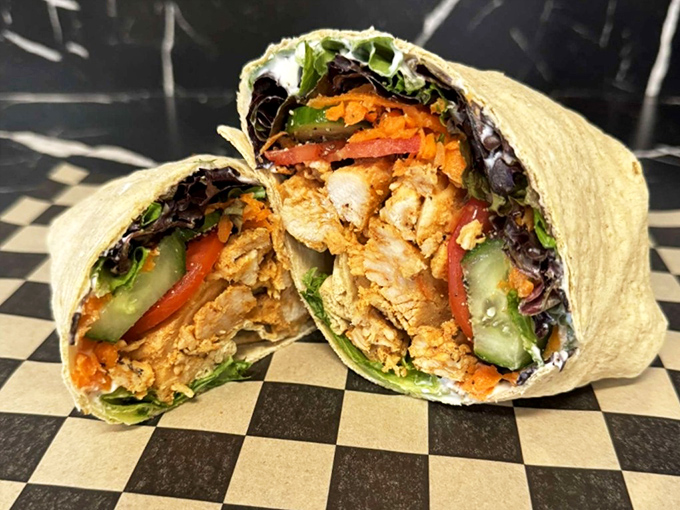 This wrap isn't just stuffed, it's having an existential crisis about containing so much goodness within its floury boundaries.