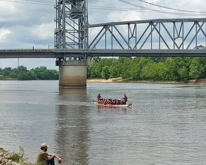 The Red River flows through Alexandria like a liquid timeline, connecting the city's past to its present while dragon boat racers add splashes of color.