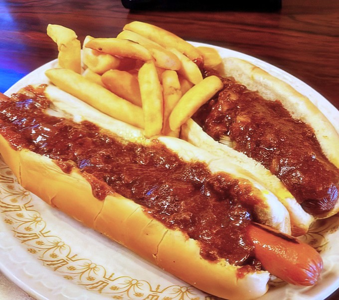Two coneys with that signature meat sauce, paired with golden fries. A duo that's caused more road trips than any travel guide.