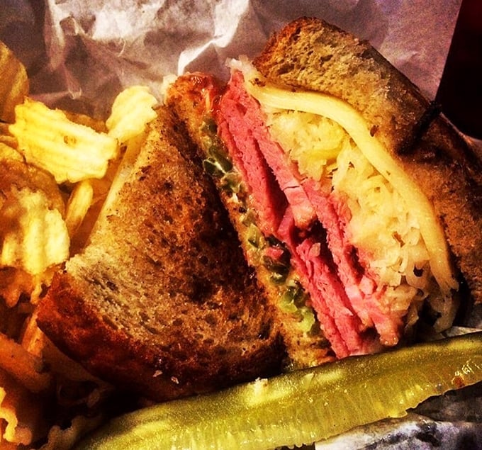 The Reuben reveals its glorious layers like a delicious geological formation. Corned beef, sauerkraut, and Russian dressing in perfect harmony.