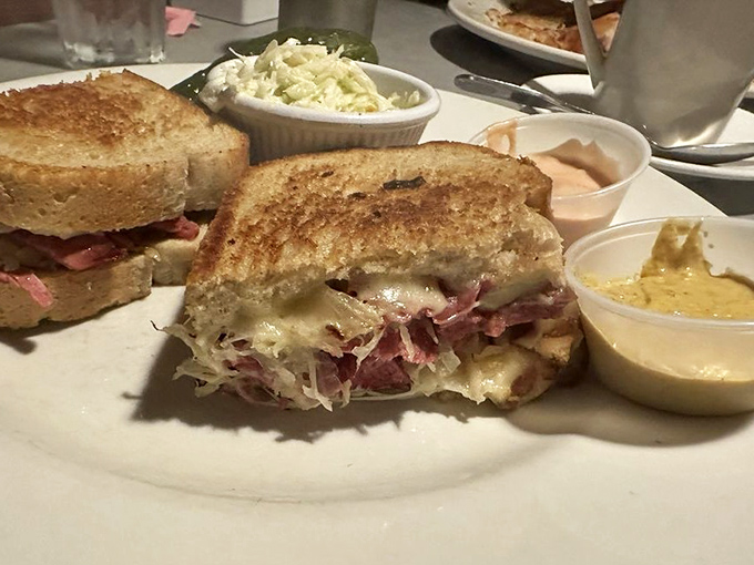 The Reuben sandwich: where corned beef, sauerkraut, and Swiss cheese gather for a meeting of minds between two perfectly grilled slices of rye.