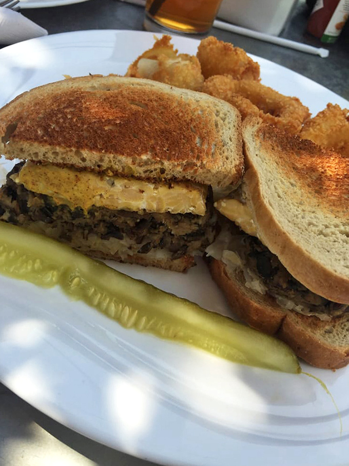 The legendary Reuben in its natural habitat &ndash; perfectly grilled rye bread housing the perfect marriage of corned beef, sauerkraut, and melted Swiss.