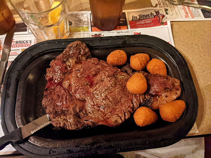 A perfectly seared ribeye with potato puffs standing guard&mdash;this plate doesn't need a filter, it needs your undivided attention.