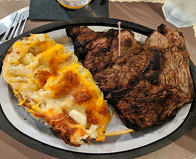 The T-bone and cheesy potato casserole&mdash;a plate that says "You won't need dinner tomorrow" in the most delicious way possible.