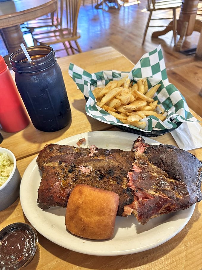 Those ribs look like they've been slow-cooking since the Carter administration. The sweet tea in that Mason jar? The perfect accomplice.