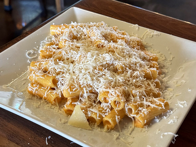 Rigatoni showered with freshly grated cheese – proof that sometimes the simplest dishes, executed perfectly, are the ones that haunt your dreams.