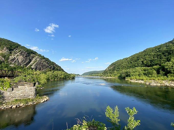 The Potomac flows like liquid history between mountain sentinels, carrying centuries of stories downstream with each ripple and current.