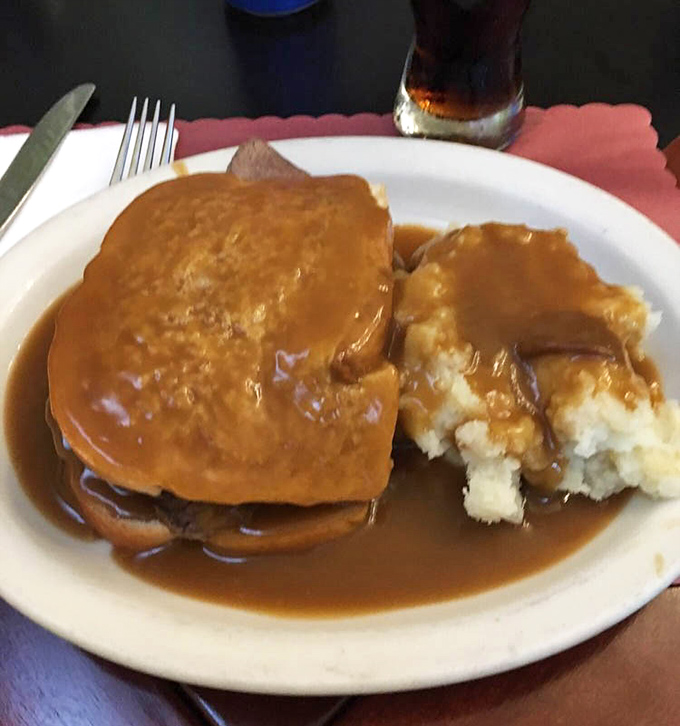 Hot roast beef with mashed potatoes and gravy&mdash;the kind of plate that makes you want to hug whoever invented the concept of gravy.