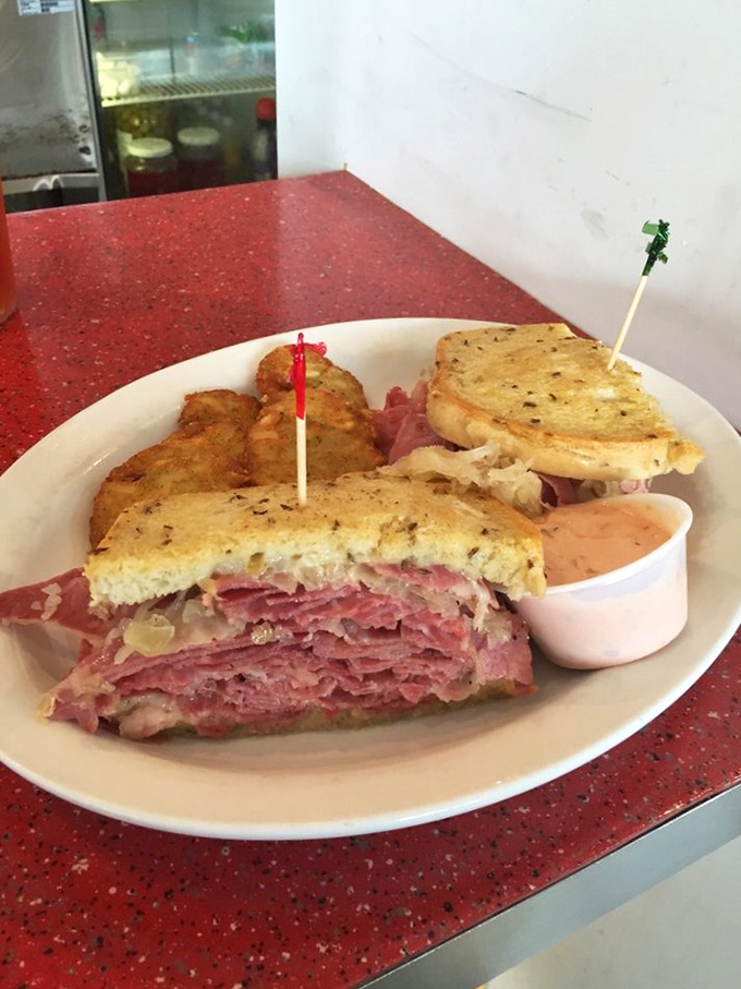 The Reuben reveals its glorious layers like geological strata of deliciousness&mdash;corned beef, sauerkraut, and Swiss cheese creating perfect harmony.