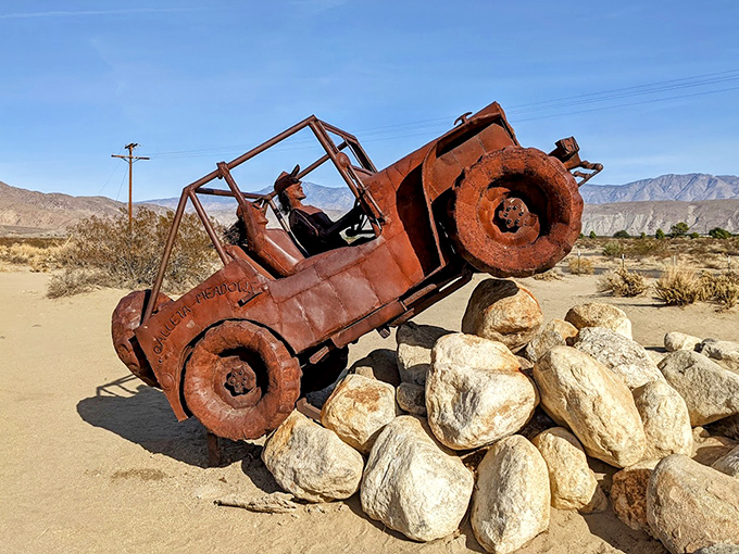 The ultimate off-road adventure ended here. This vintage Jeep sculpture looks like it's still tackling the rocky terrain.