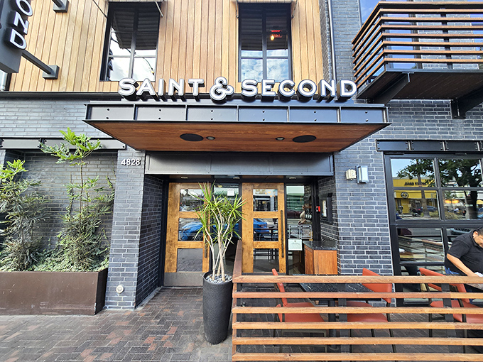 Saint & Second's sleek exterior promises sophisticated urban dining, where the wood and metal elements say "yes, we take our cocktails and cuisine seriously."