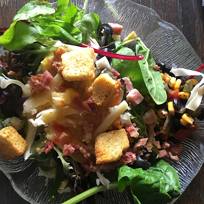 This isn't just a salad&mdash;it's a colorful canvas of fresh ingredients, crispy croutons, and savory bits that make vegetables worth celebrating.