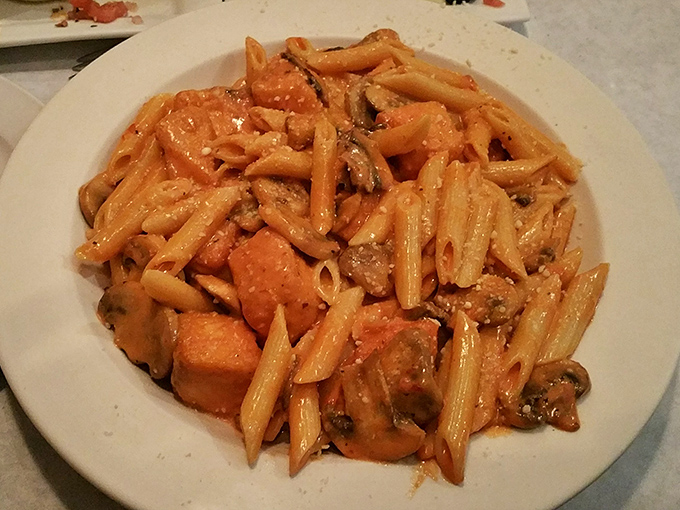 Salmon and penne play a delicious game of hide-and-seek with mushrooms in this hearty pasta dish that screams "comfort food with class."