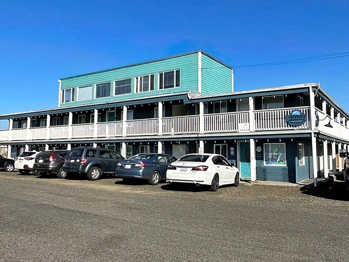 The Sand Dollar Condos offer that perfect coastal color palette&mdash;seafoam green with white trim&mdash;like the ocean decided to try its hand at architecture.