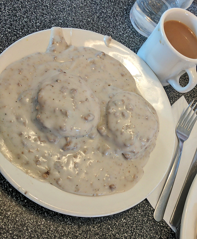 Sausage gravy blankets these biscuits like a warm Pennsylvania snowfall&mdash;comforting, generous, and guaranteed to make you forget about any diet resolutions.