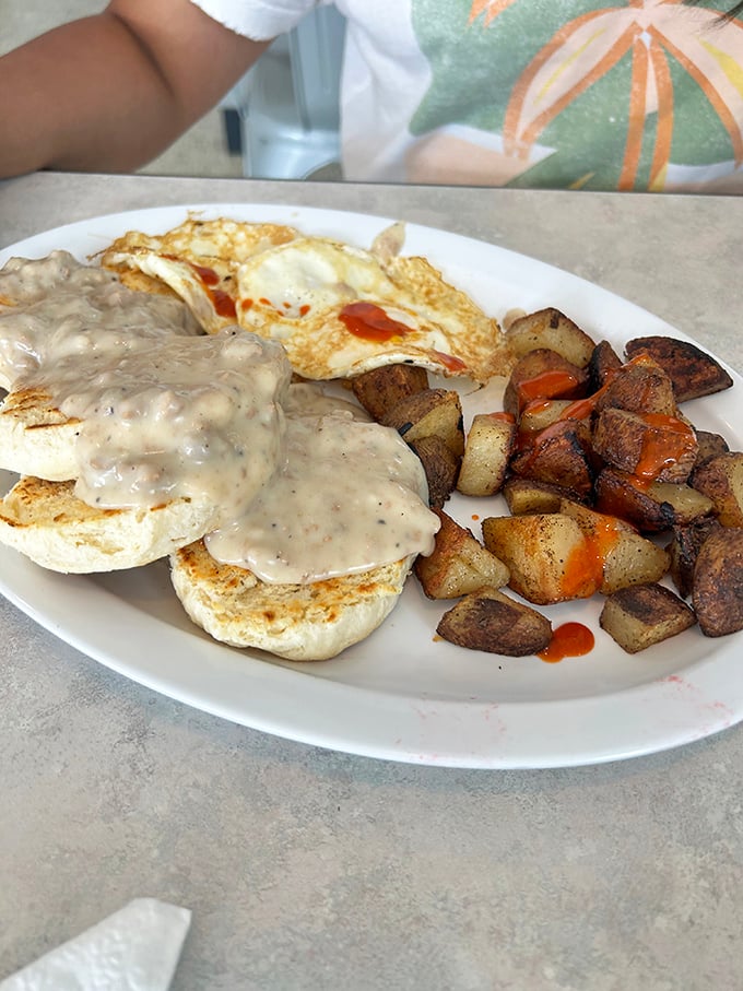 Biscuits drowning happily in sausage gravy &ndash; the breakfast equivalent of a warm hug from your favorite aunt who never counted calories.