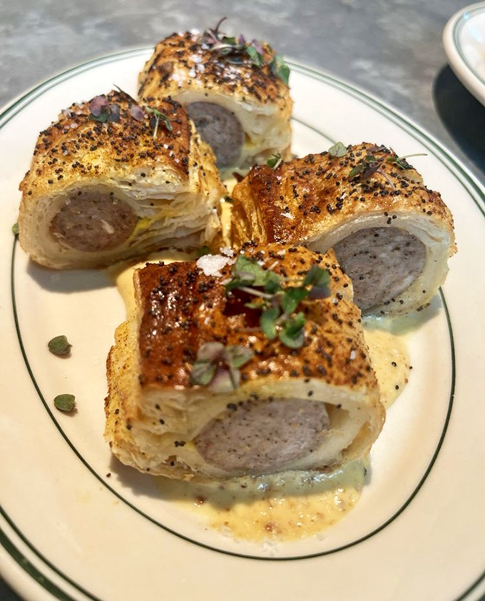 Sausage rolls wrapped in flaky pastry&mdash;like pigs in blankets that went to Oxford and came back with a fancy degree.