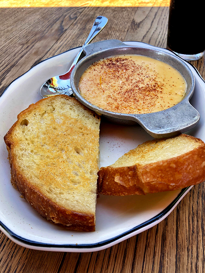 The Scotch Rarebit: where cheese meets ale in a relationship more harmonious than most Hollywood marriages. Served with toast for essential dipping.