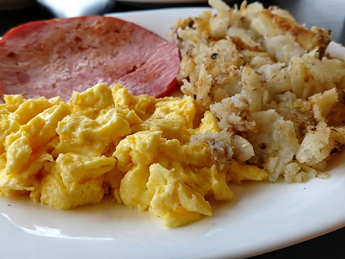 Scrambled eggs so fluffy they could practically float off the plate, paired with home fries that crackle with each bite. Simple perfection.