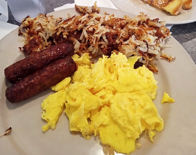 Scrambled eggs that actually look like someone cared, paired with hash browns that achieved the perfect crisp-to-tender ratio. Breakfast nirvana.