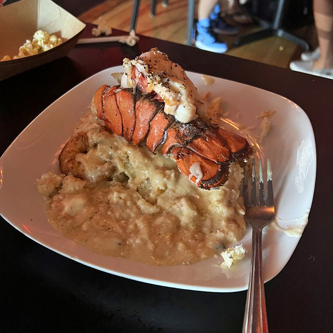 This isn't just seafood&mdash;it's a coastal romance story told through butter-poached lobster tail and creamy grits. A dish worth committing to memory.