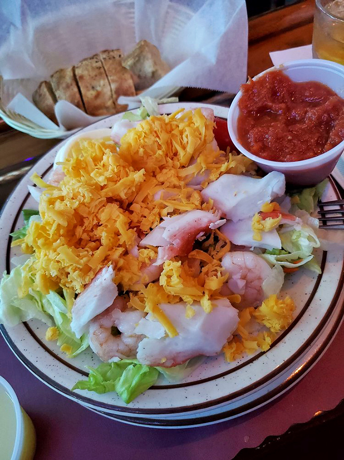 This seafood salad proves that sometimes the best ocean treasures don't need to be deep-fried or butter-drenched to shine&mdash;though the bread in the background suggests carbs aren't being neglected.