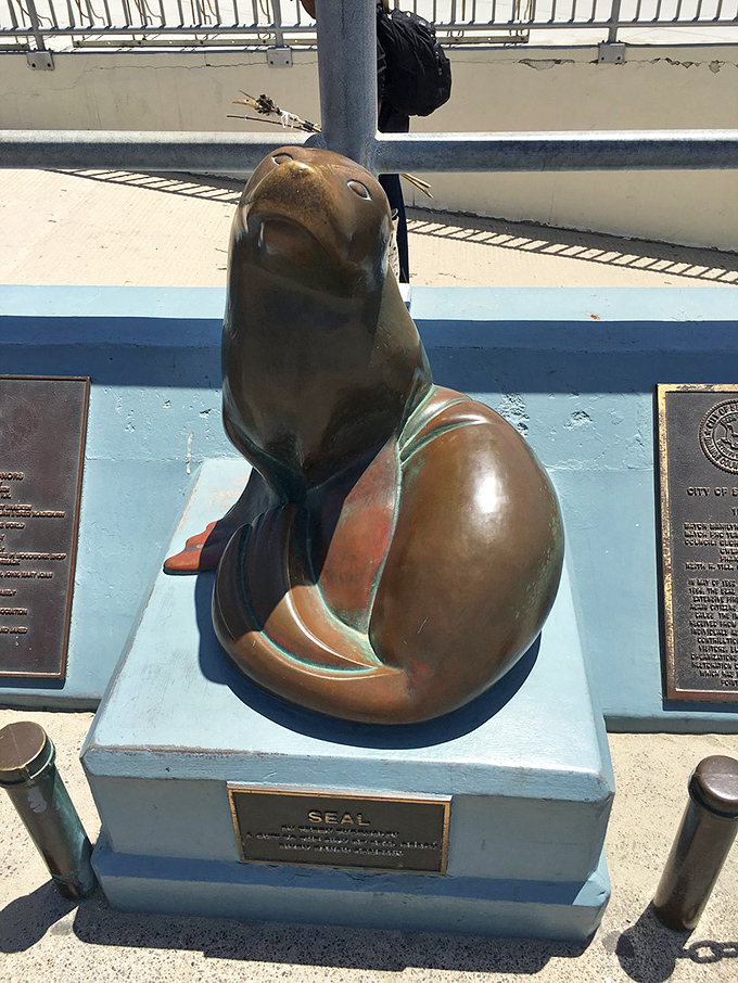 This bronze seal statue stands as the town's unofficial greeter, wearing the satisfied expression of someone who knows they live in paradise.