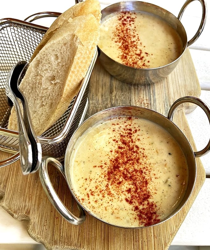 She-crab soup served with style&mdash;velvety, rich, and topped with a sprinkle of paprika. The bread basket is just a vehicle for sopping up every last drop.