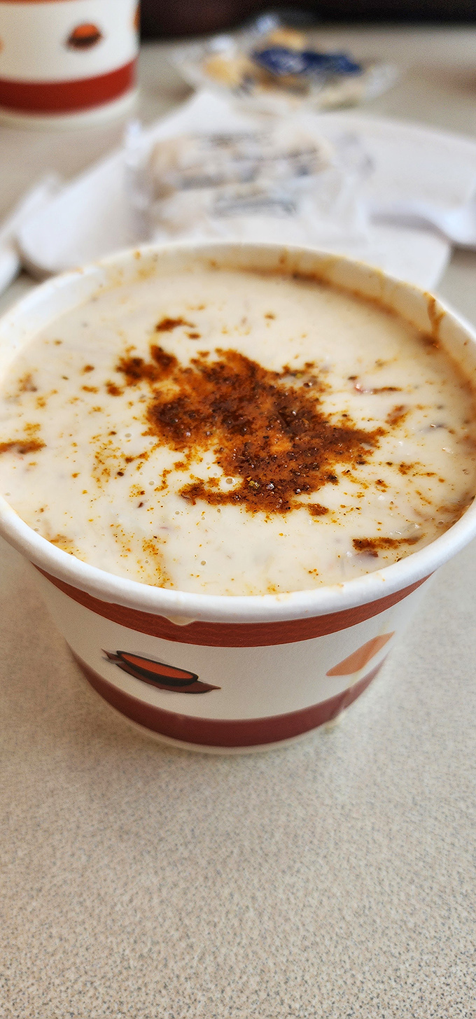 She-crab soup that's richer than a tech billionaire. That sprinkle of spice on top isn't garnish&mdash;it's the crown jewel of comfort food royalty.