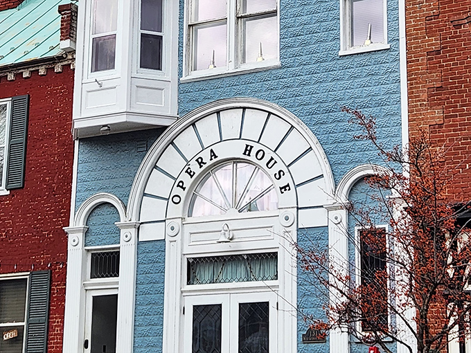 The Opera House's distinctive blue facade and elegant archway stand as a colorful reminder that small towns can deliver big cultural experiences.