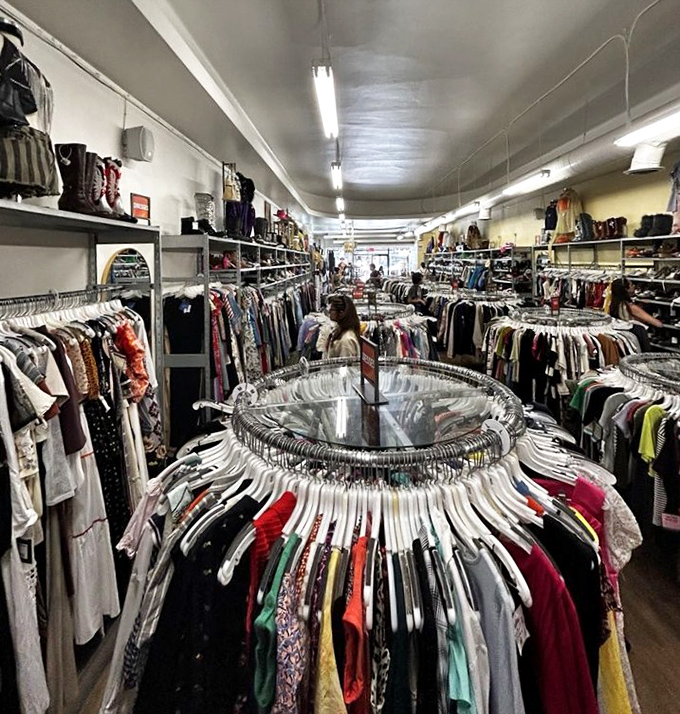 The circular rack system creates a fashion laboratory where shoppers can experiment with styles they'd never consider at full retail prices.