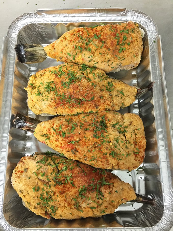 Stuffed clams that look like they've been sprinkled with culinary pixie dust. That vibrant seasoning isn't just color&mdash;it's a promise of flavor.