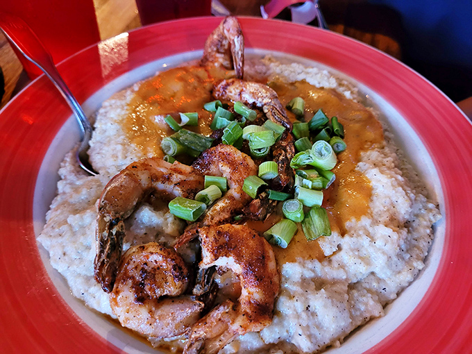Shrimp and grits that would make a Southerner weep with joy – comfort food that's gotten a beach vacation upgrade.