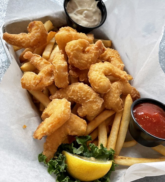 Crispy, golden shrimp perched atop fries&mdash;comfort food that's been to finishing school. The perfect marriage of casual and gourmet that defines JP's approach.