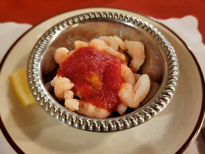 A silver chalice of plump shrimp with a dollop of cocktail sauce—ocean treasures served with simple elegance that lets the quality speak for itself.