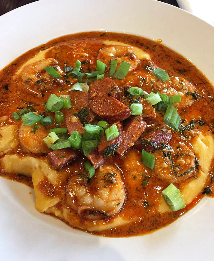 Shrimp and grits swimming in a spicy sauce that would make your Southern grandmother both proud and slightly jealous of the recipe.