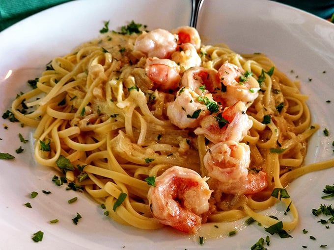 Shrimp scampi twirls around perfectly cooked pasta, bathed in garlic butter that would make Italian grandmothers pause and reconsider their recipes.